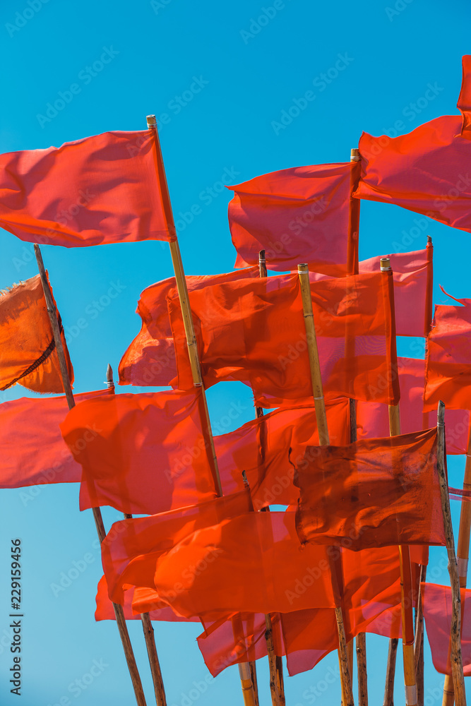 Fishing boat and red flags flying in wind Stock Photo | Adobe Stock
