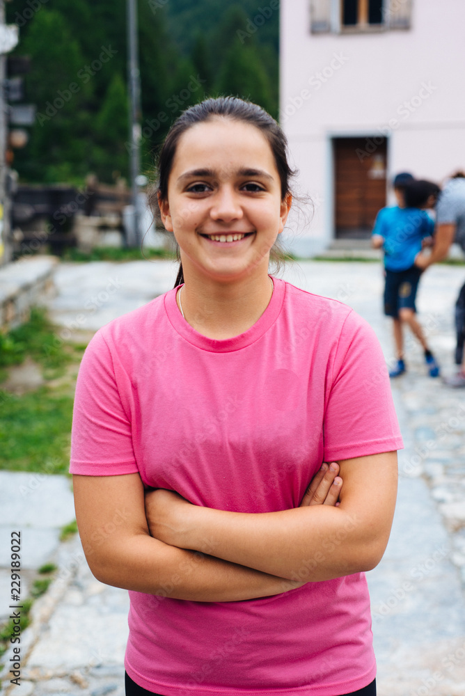 portrait of a 12 year old girl in the mountain village of the Alps ...