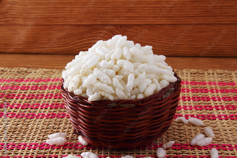 uncooked puffed rice in basket for indian gujarati traditional ...