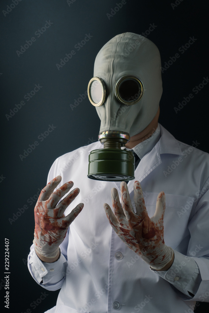 Evil and creepy medical experiment concept, a scary doctor in gas mask ...