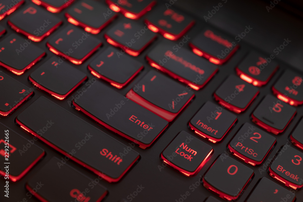 Colorful keyboard for gaming. Backlit keyboard with red color scheme ...