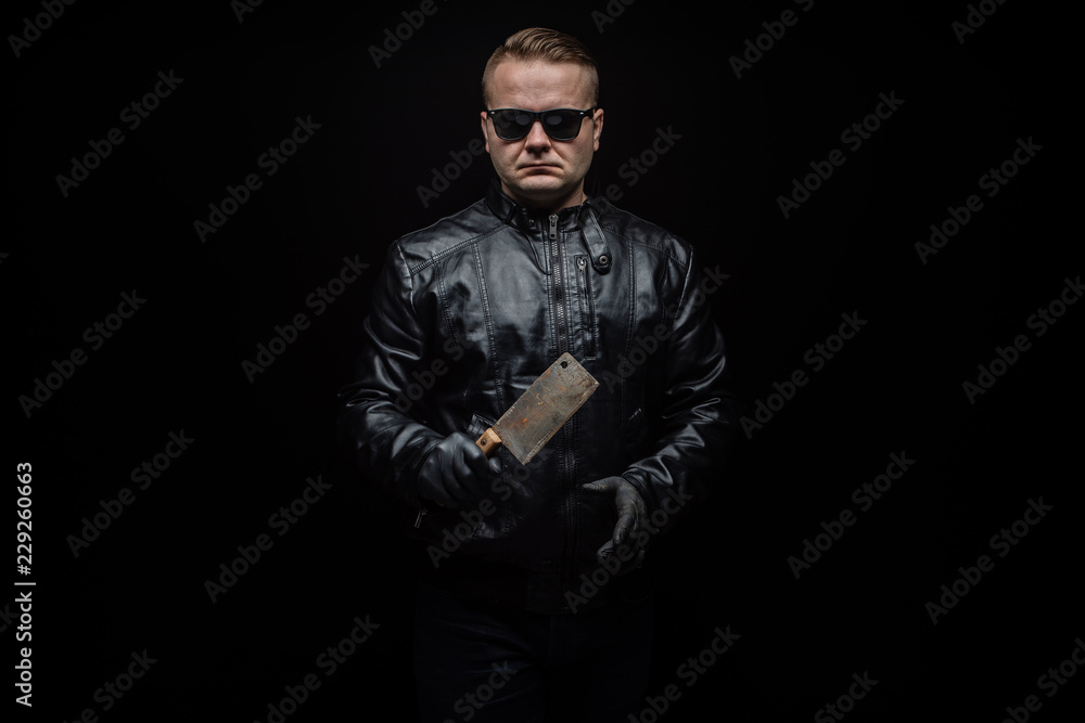 Serial killer maniac with meat cutter and black gloves Stock Photo ...
