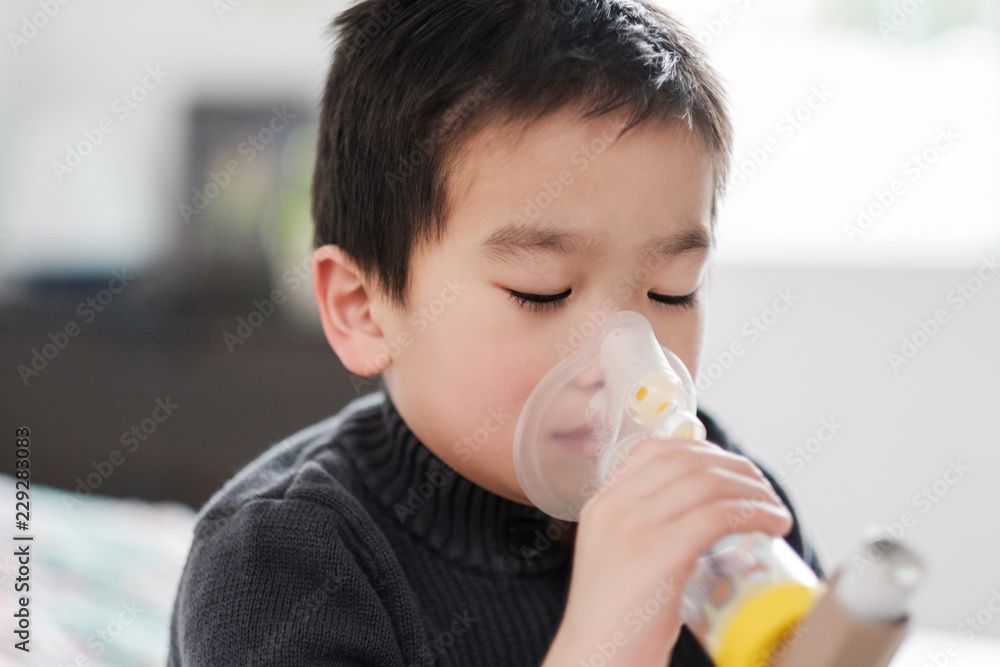 Asian Kid Using Asthma Inhaler Medication Stock Photo | Adobe Stock