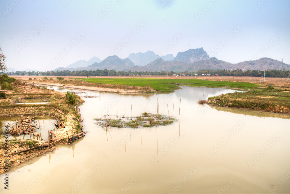 Landscape with lake and mountains in the background near Hpa-An in ...