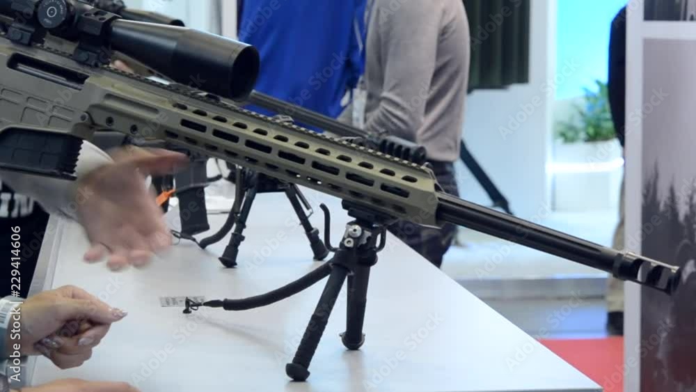 Several large-caliber weapons on the table. Firearms gun submachine ...