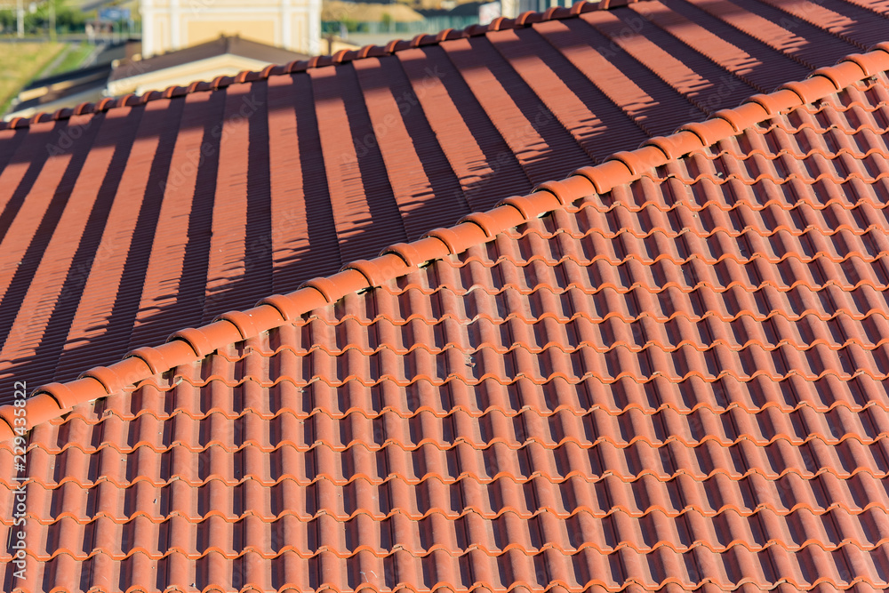 The roof of a high-rise building. Roof made of clay tiles ...