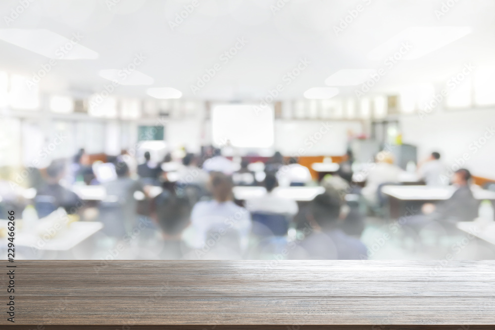Wood Table Top Background on blurred people lecture in seminar room ...