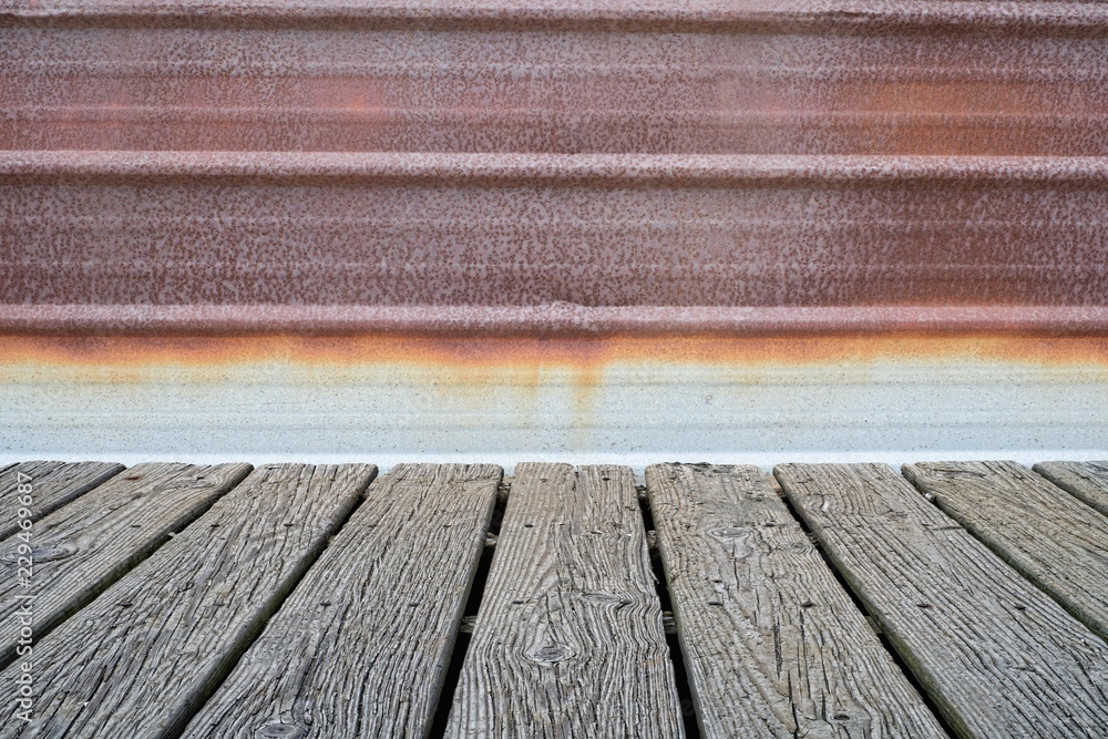 EMPTY WOOD DECK WITH CLOSE UP RUSTED METAL SHEET.BACKGROUND (FOR ...
