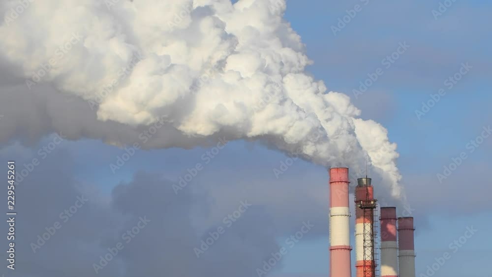 Smoke from the pipes of plant. Clouds of white smoke. Energy generation ...