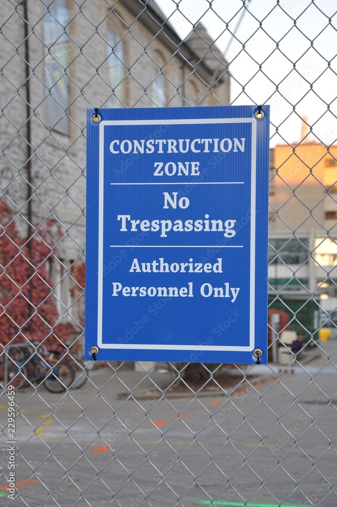 Construction zone, no trespassing, authorized personnel only signage ...