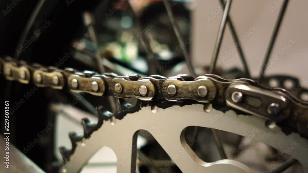 The rear wheel of the motorcycle to spin. chain and star closeup Stock ...