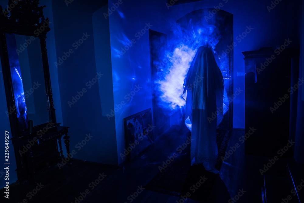 Horror silhouette of ghost inside dark room with mirror Scary halloween ...
