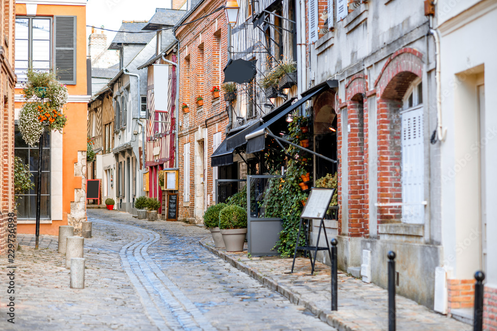 Street view with beautiful old buildings in Honfleur, famous french ...