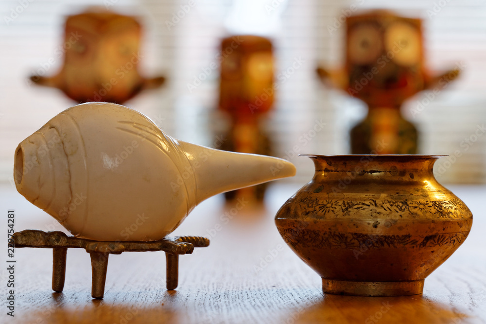 Conch shell with brass water pot and Hindu deity Lord Jagannath in the ...
