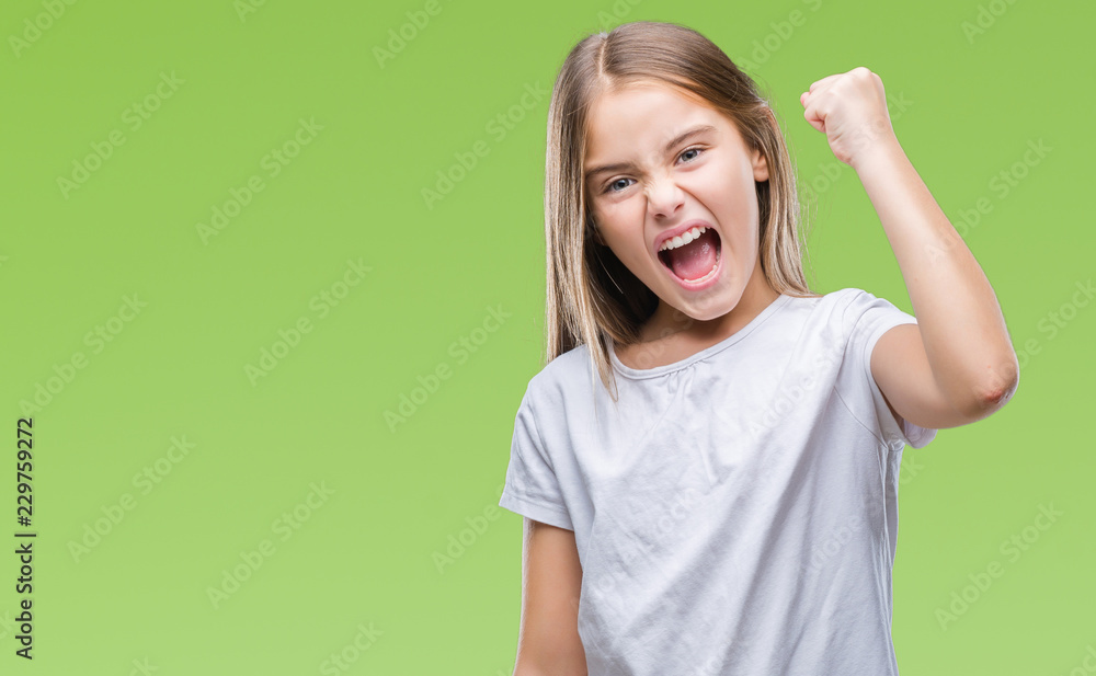 Young beautiful girl over isolated background angry and mad raising ...