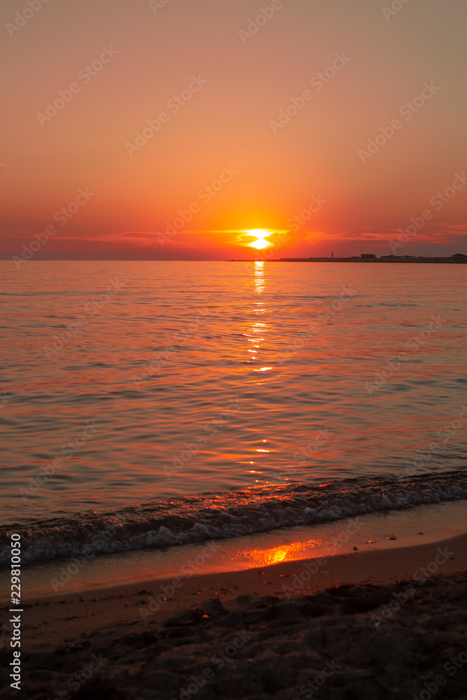 Sunset over water Stock Photo | Adobe Stock