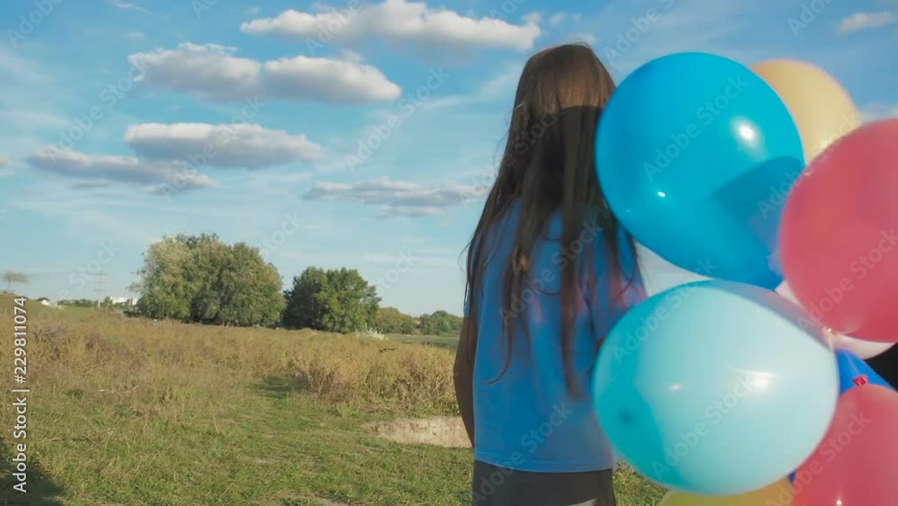 Sad child with balloons. Leaving childhood. Sad little girl with ...