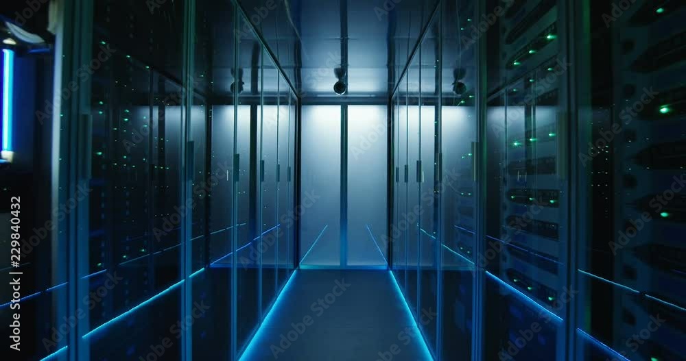 Vidéo Stock Wide movement shot of a long hallway full server racks in a ...