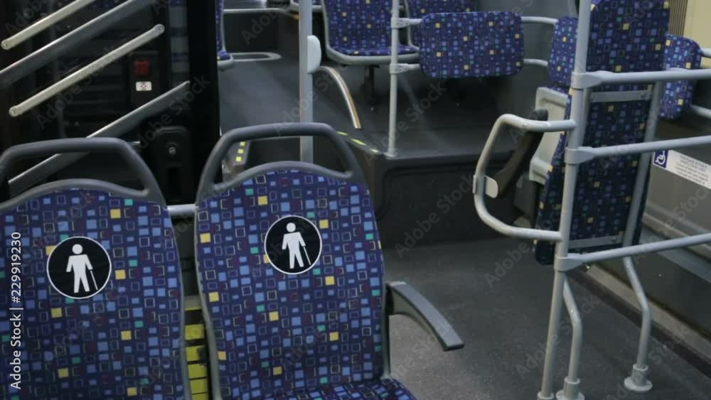 modern city bus with seats for disabled and elderly people. Place for a ...