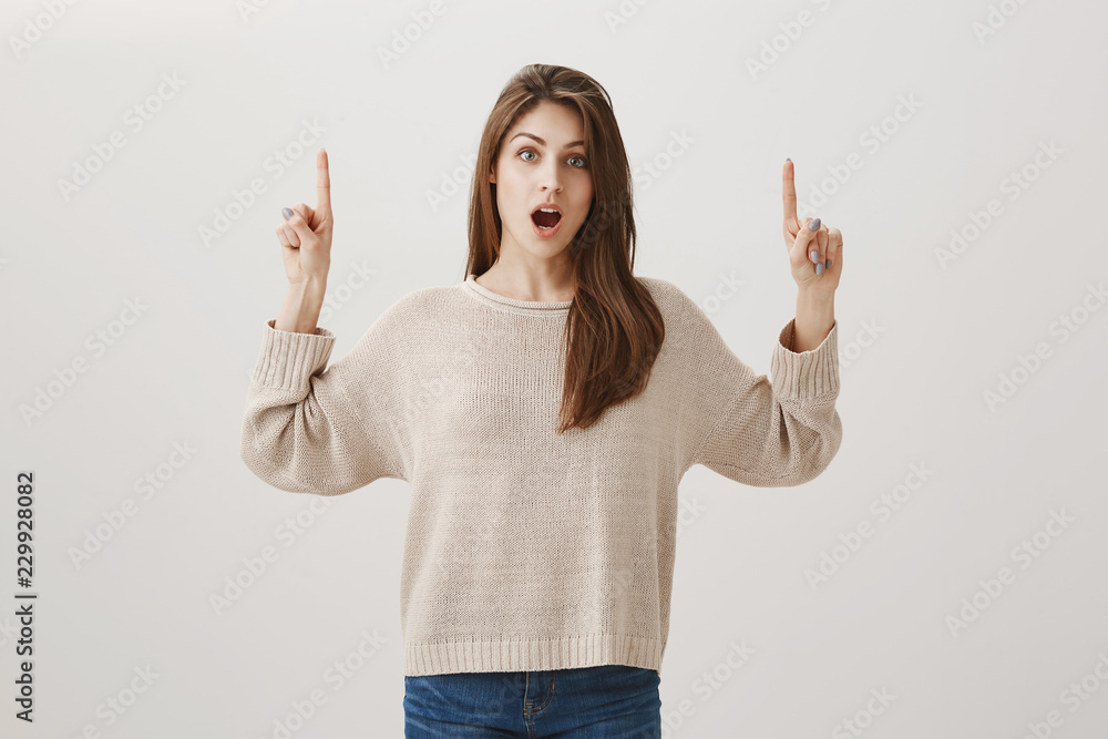 Have you seen that. Indoor shot of attractive shocked female in ...