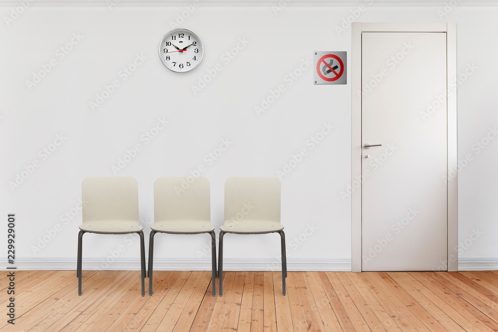 empty waiting room with chairs, clock on wall and close door with no ...