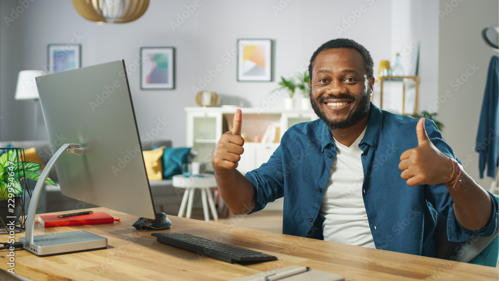 Portrait of the Handsome Black Man Works on a Personal Computer, Has ...