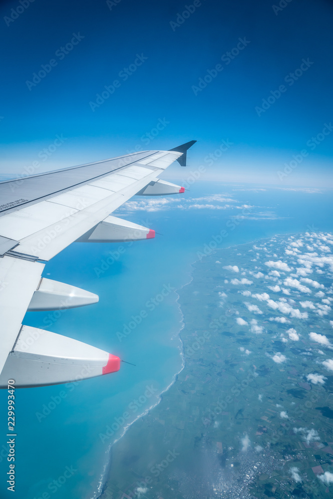 Airplane Flying Over Ocean