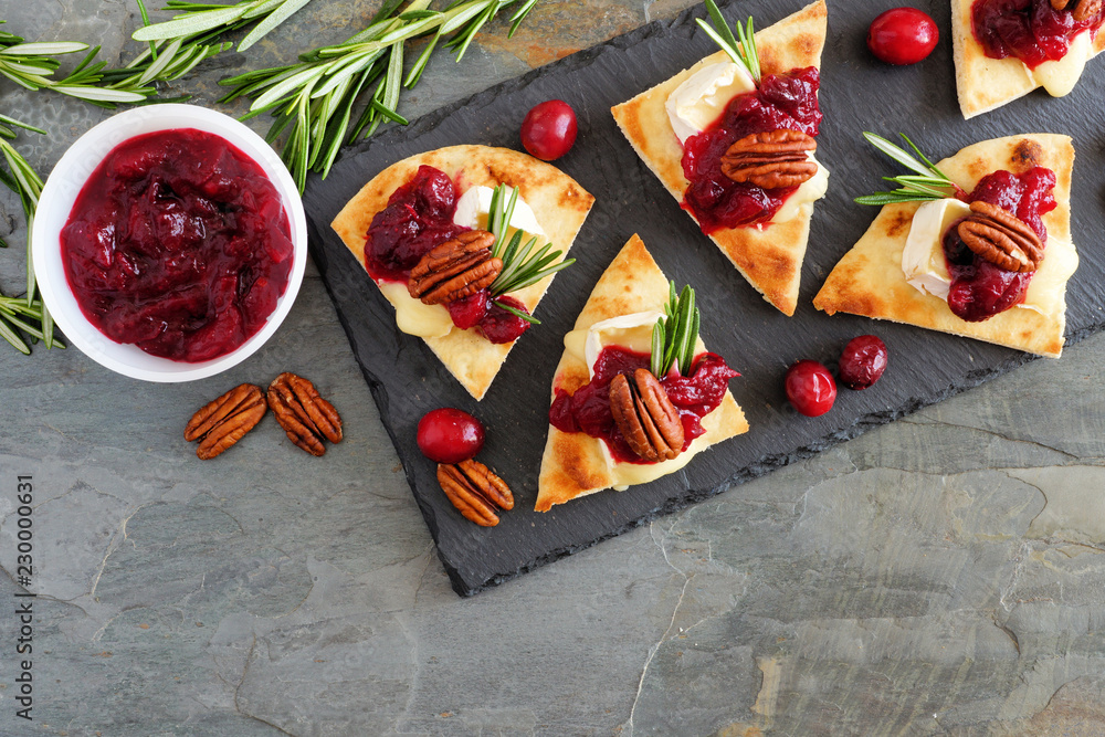 Holiday flatbread appetizers with cranberries, pecans and brie cheese ...