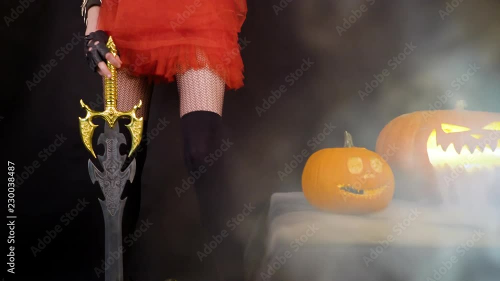 Girl celebrate halloween with burning pumpkins, have fun, rejoices ...