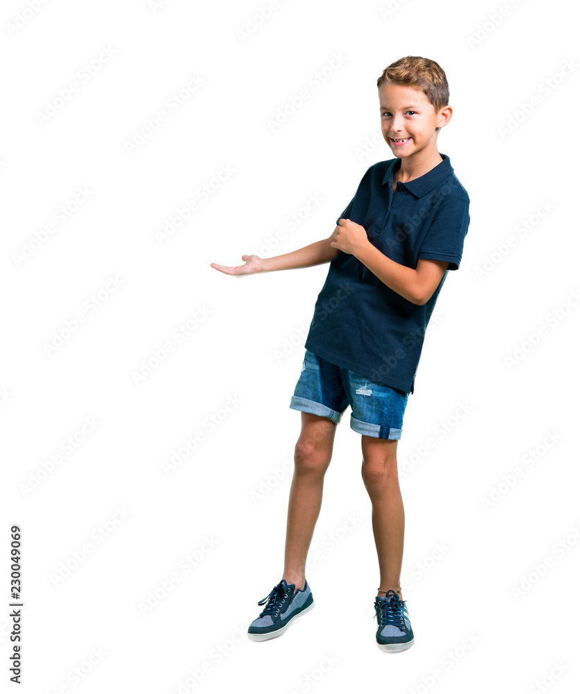 Full body of Little boy pointing back with the index finger on white ...
