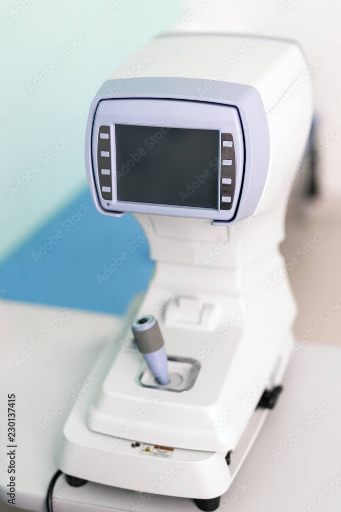 Modern ophthalmology clinic. Keratometer device measuring curvature of ...