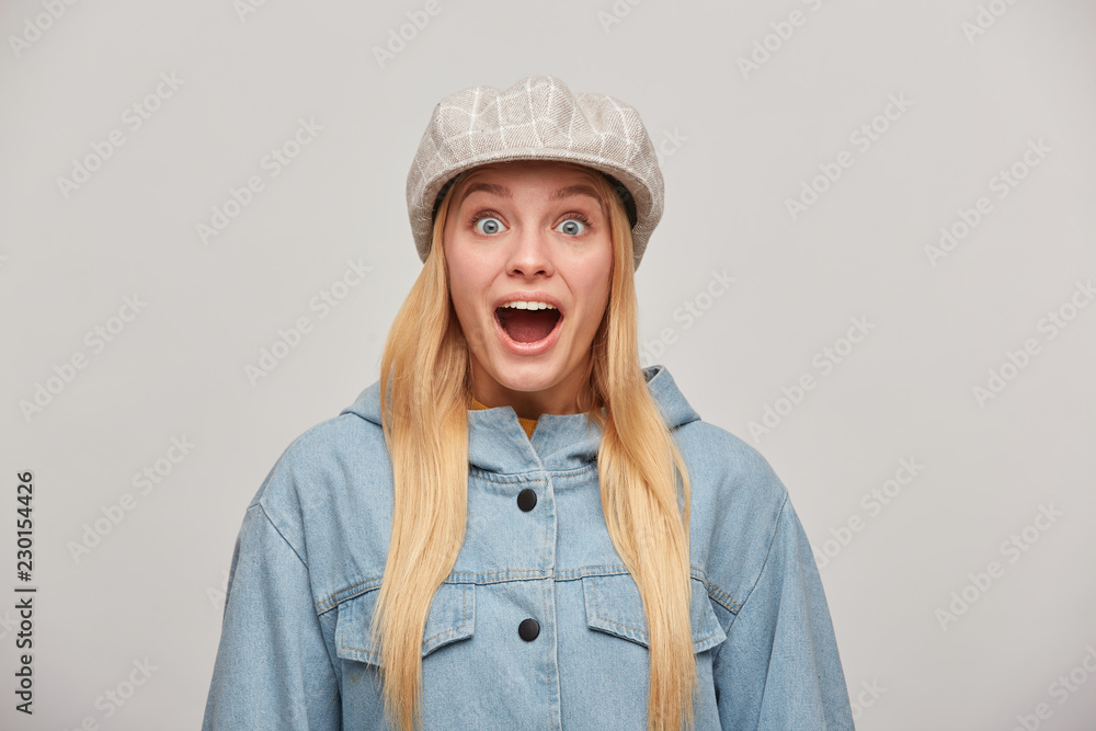Lovely Blonde Girl With Long Hair Down Looks Delighted Gladden Amazed Mouth Open Like Dream