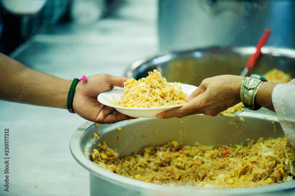 The hands of beggars offer food from the donor : The life of the poor ...