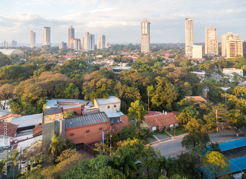 View of skyscrapers and villas in outer suburb district of Latin ...