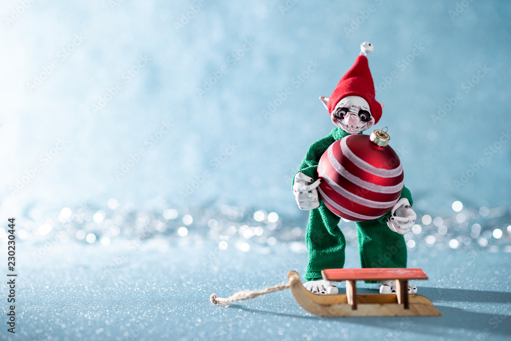 Cute Cheerful Santas Helper Elf Loading Christmas Bauble Onto Santas ...