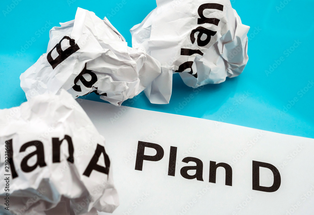 Crumpled paper Plan A B C and clean sheet Plan D isolated on blue ...