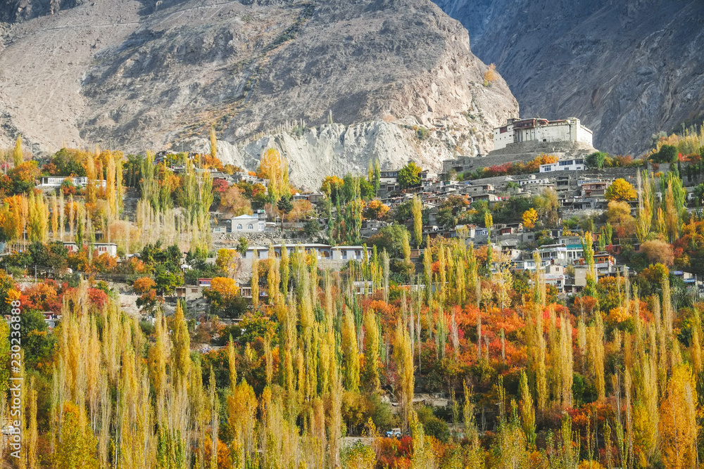 Autumn in Hunza valley with a view of Baltit fort and villages surround ...