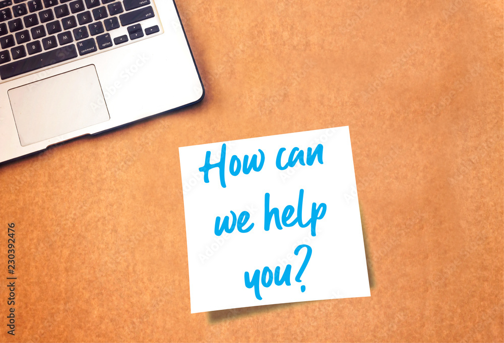 How can we help you Sign on sticky note and laptop on table Stock Photo ...