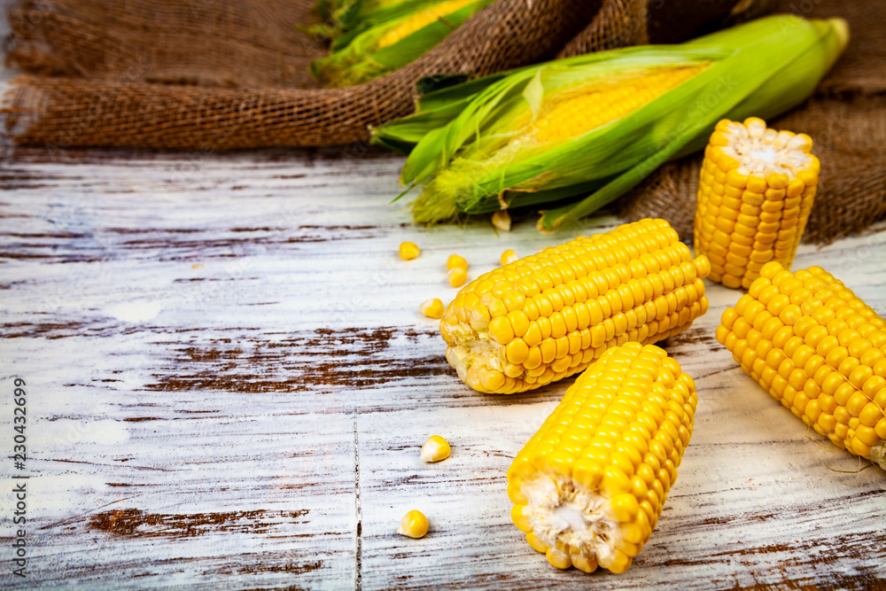 Ripe corn on a wooden table Stock Photo | Adobe Stock
