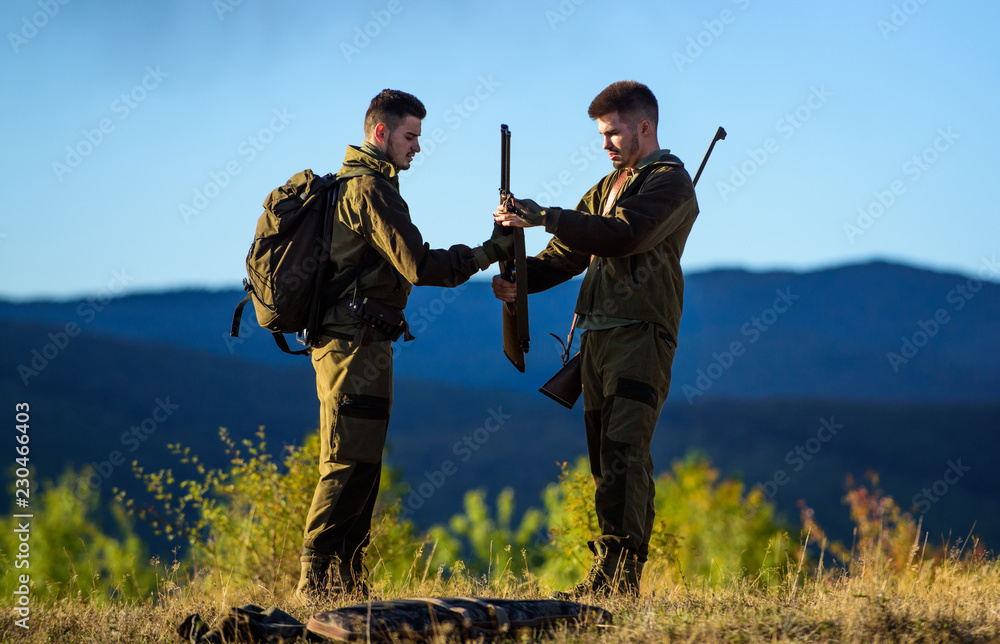 Masculine hobby activity. Men bearded hunters with rifle nature ...