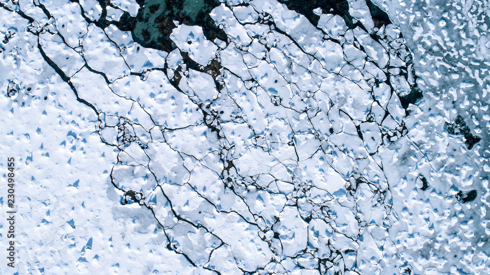 Ice breaking into pieces in a body of water Stock-Foto | Adobe Stock