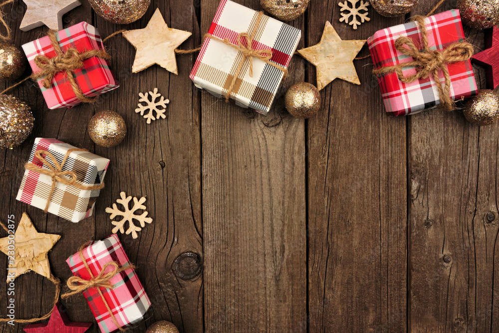 Christmas corner border with gifts and rustic decorations on an aged ...