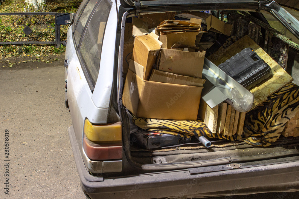 unnecessary garbage carried in the trunk of an old car Stock Photo ...