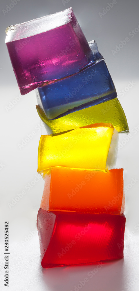 Foto de Cubes of translucent rainbow colored gelatin do Stock | Adobe Stock