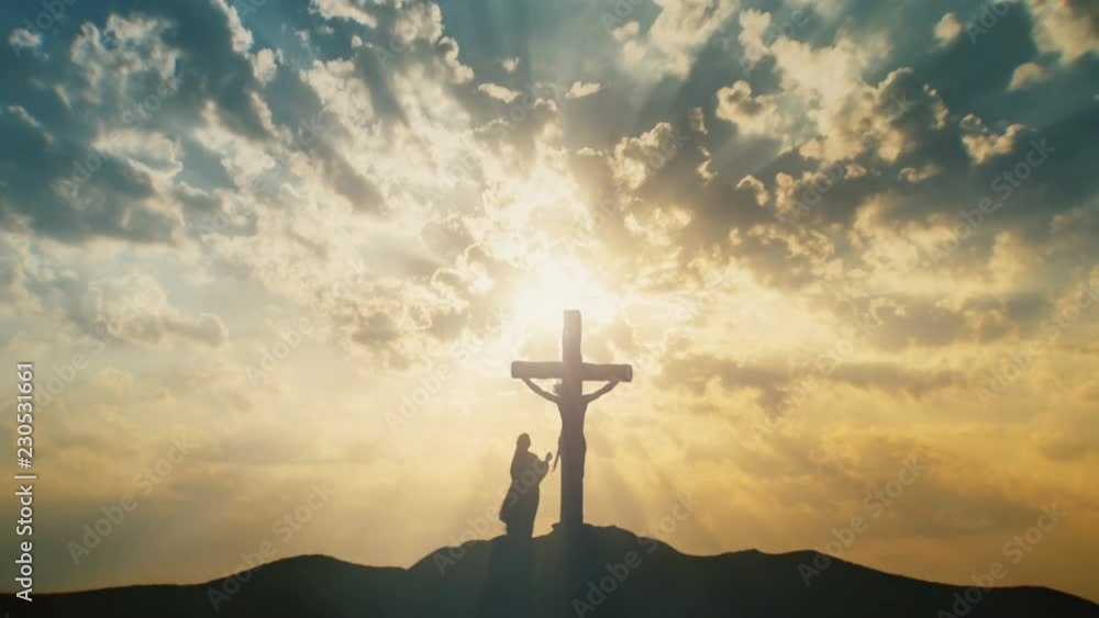 Silhouette of Mary praying at Holy Cross. Jesus Christ crucifixion ...