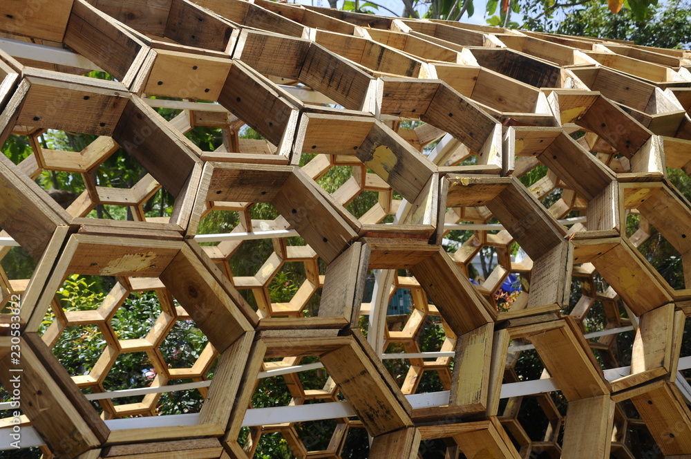 Shading walkway made of wood in the shape of a hexagon at Floria Garden ...