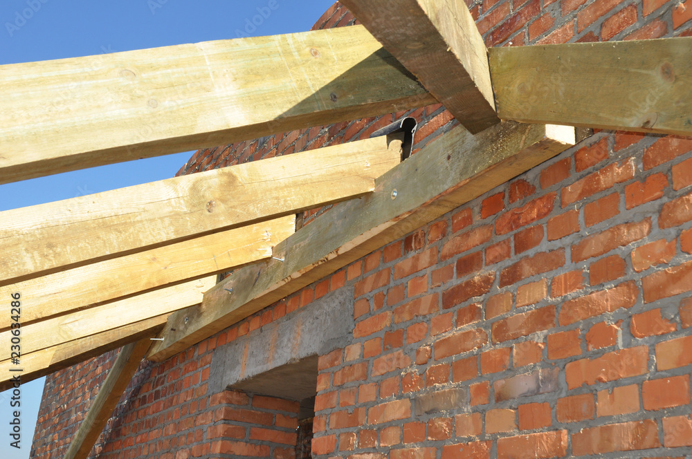 Roofing construction. House roof wooden rafters, eaves, waterproofing ...