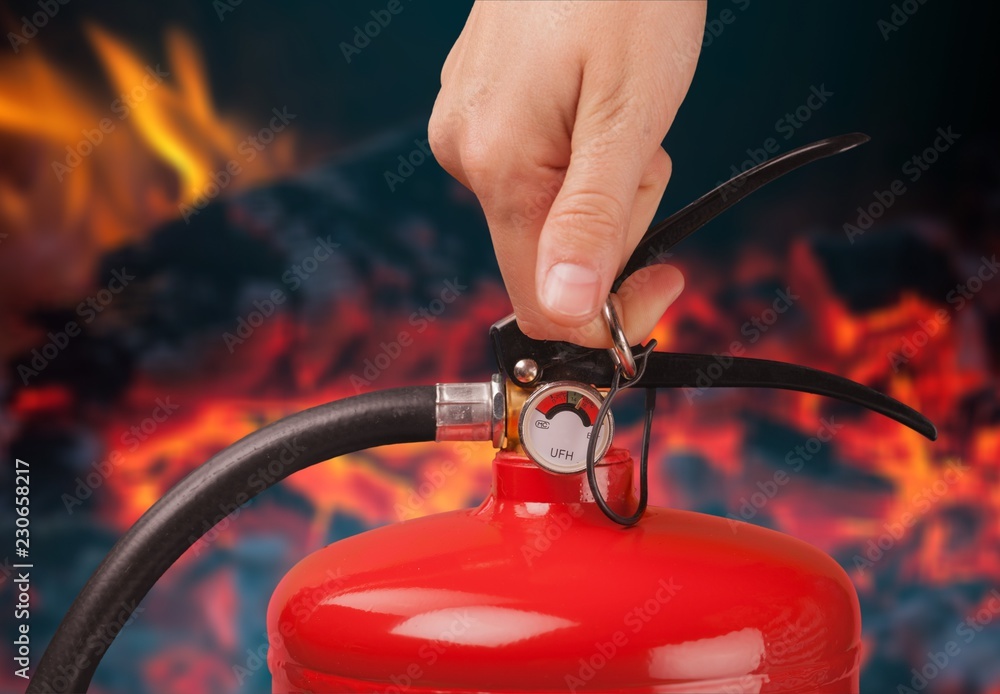 Hand presses the trigger fire extinguisher hand presses the Stock Photo ...