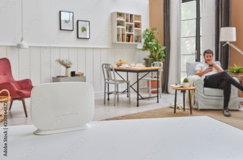 Router modem close up modern living room background and man connecting ...