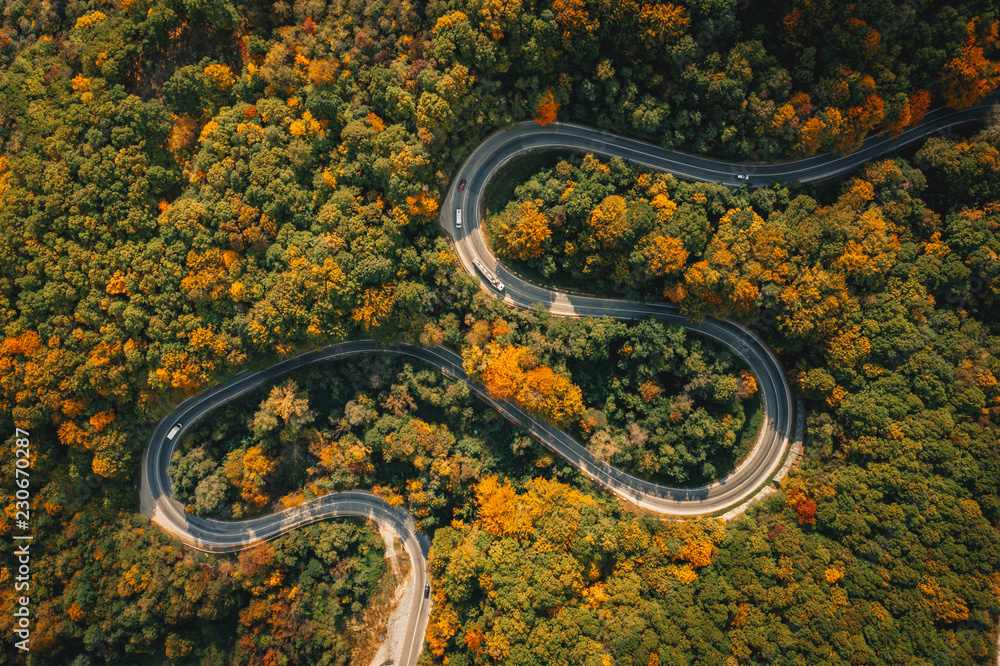 Road seen from above. Aerial view of an extreme winding curved road in ...